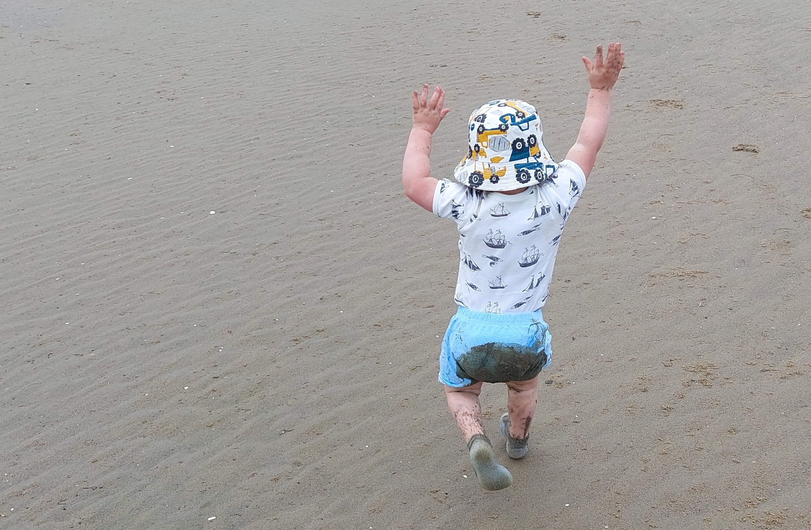 Removing sand with a bucket and plunger | Clean Cloth Nappies